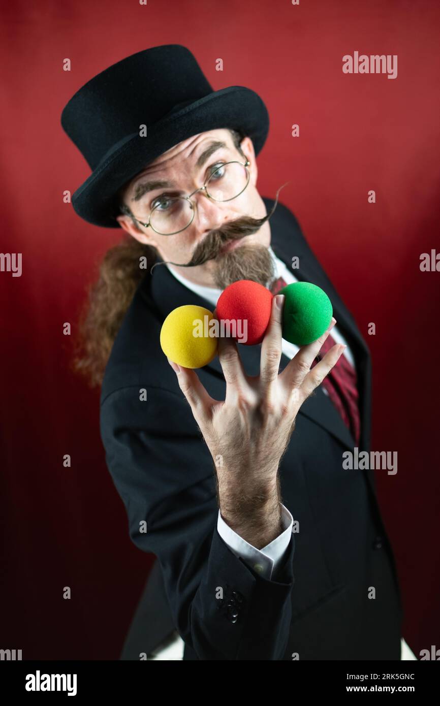 Vintage Caucasian Magician with top hat, glasses and mustache with ...
