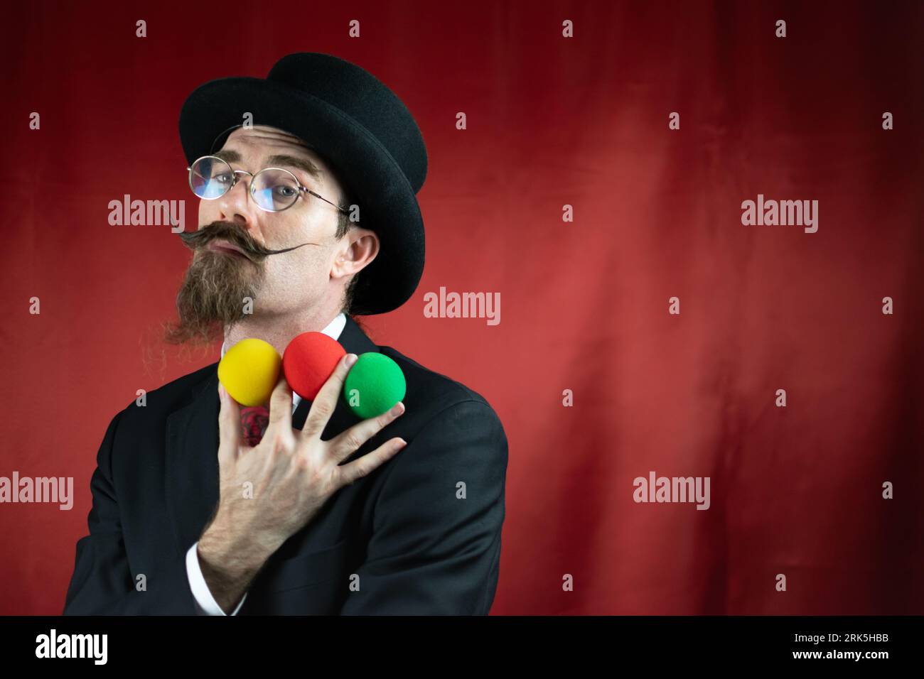 Vintage Caucasian Magician with top hat, glasses and mustache with ...
