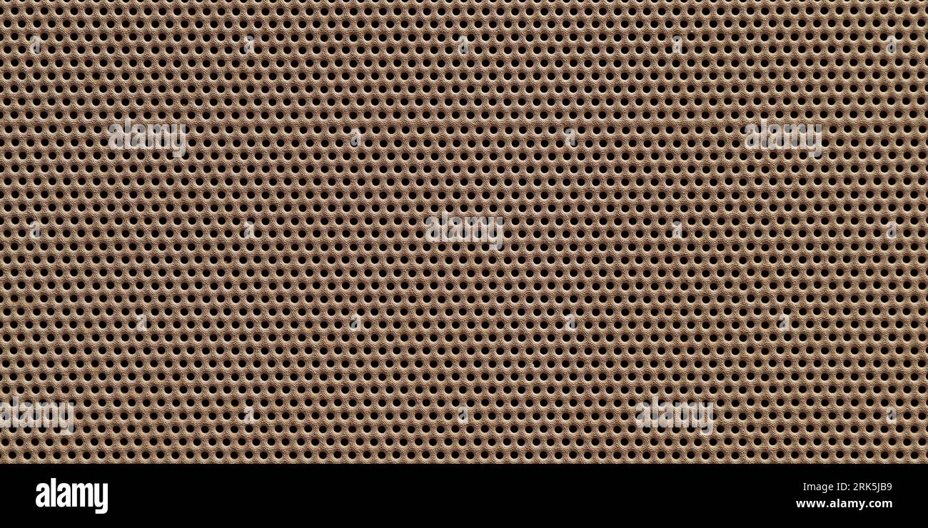 A close-up of an old, vintage radio speaker grid with a textured ...