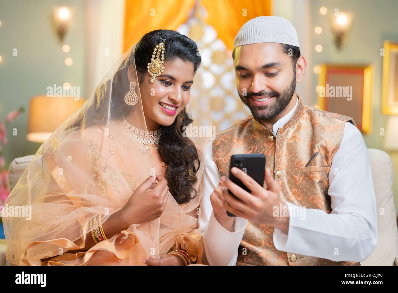 Smiling muslim couple talking during hi-res stock photography and ...