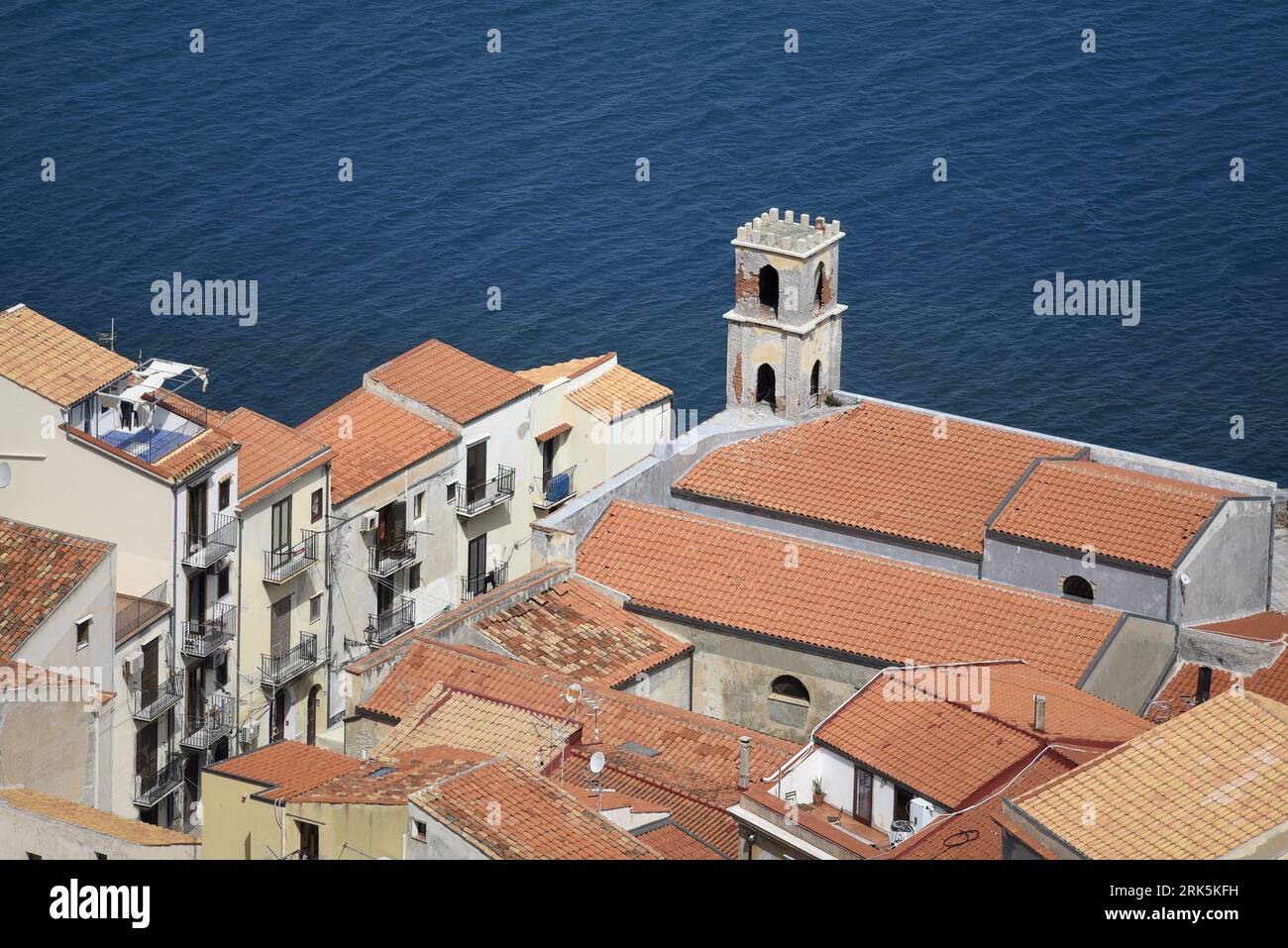 Scenic view of red clay tile rooftops in Cefalù one of the most ...