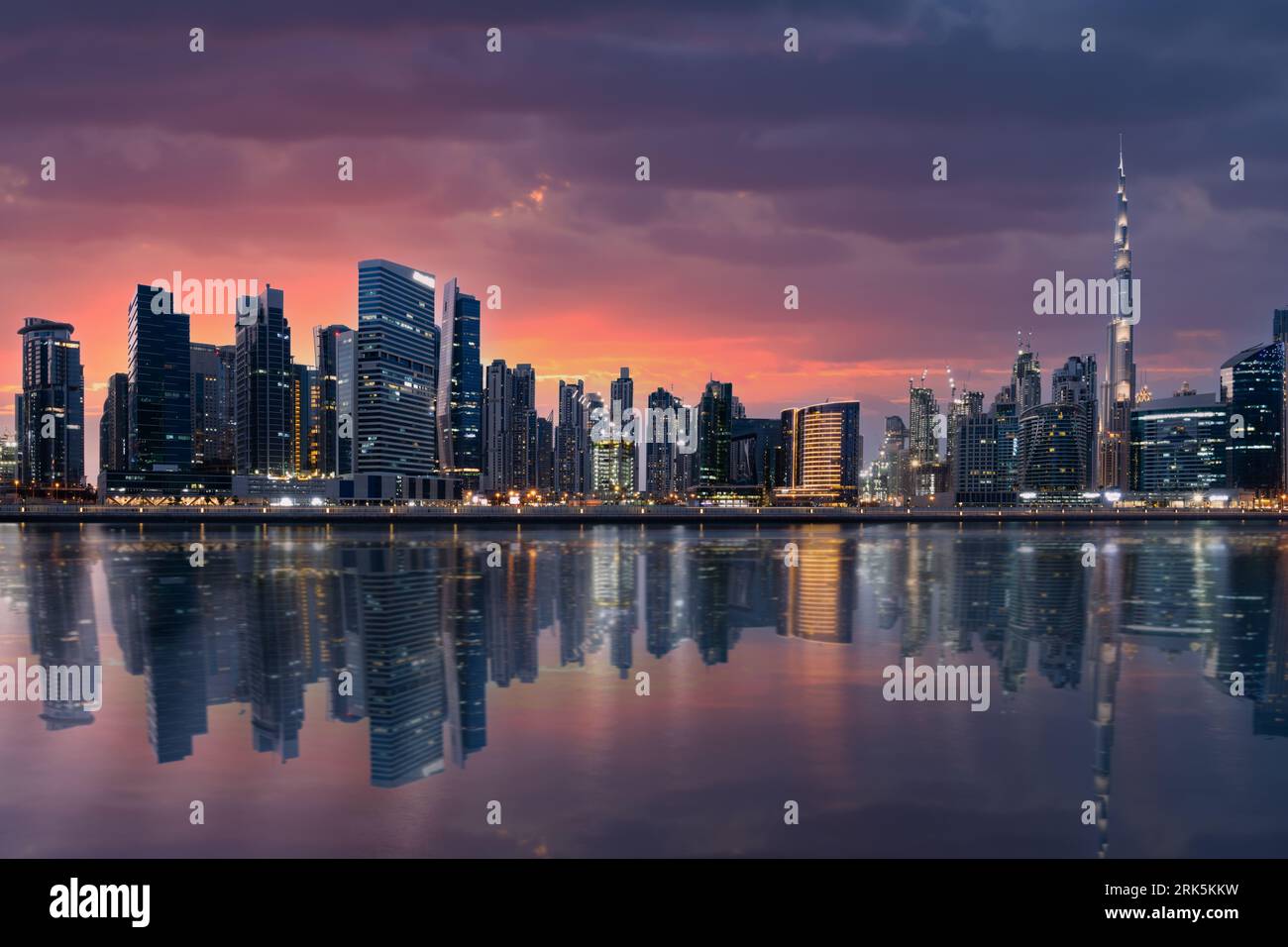 Stunning view of the illuminated Dubai skyline at sunset with the ...