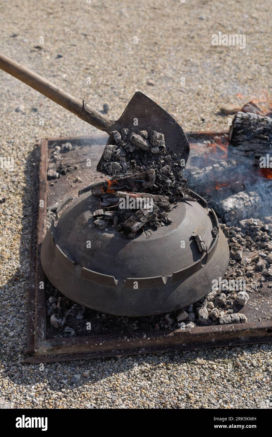 A vertical of Peka, a traditional method of preparing meal in Croatia ...