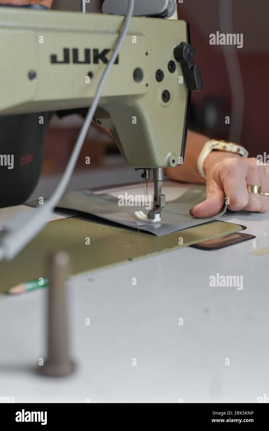 A closeup of the process of sewing on a sewing machine Stock Photo - Alamy