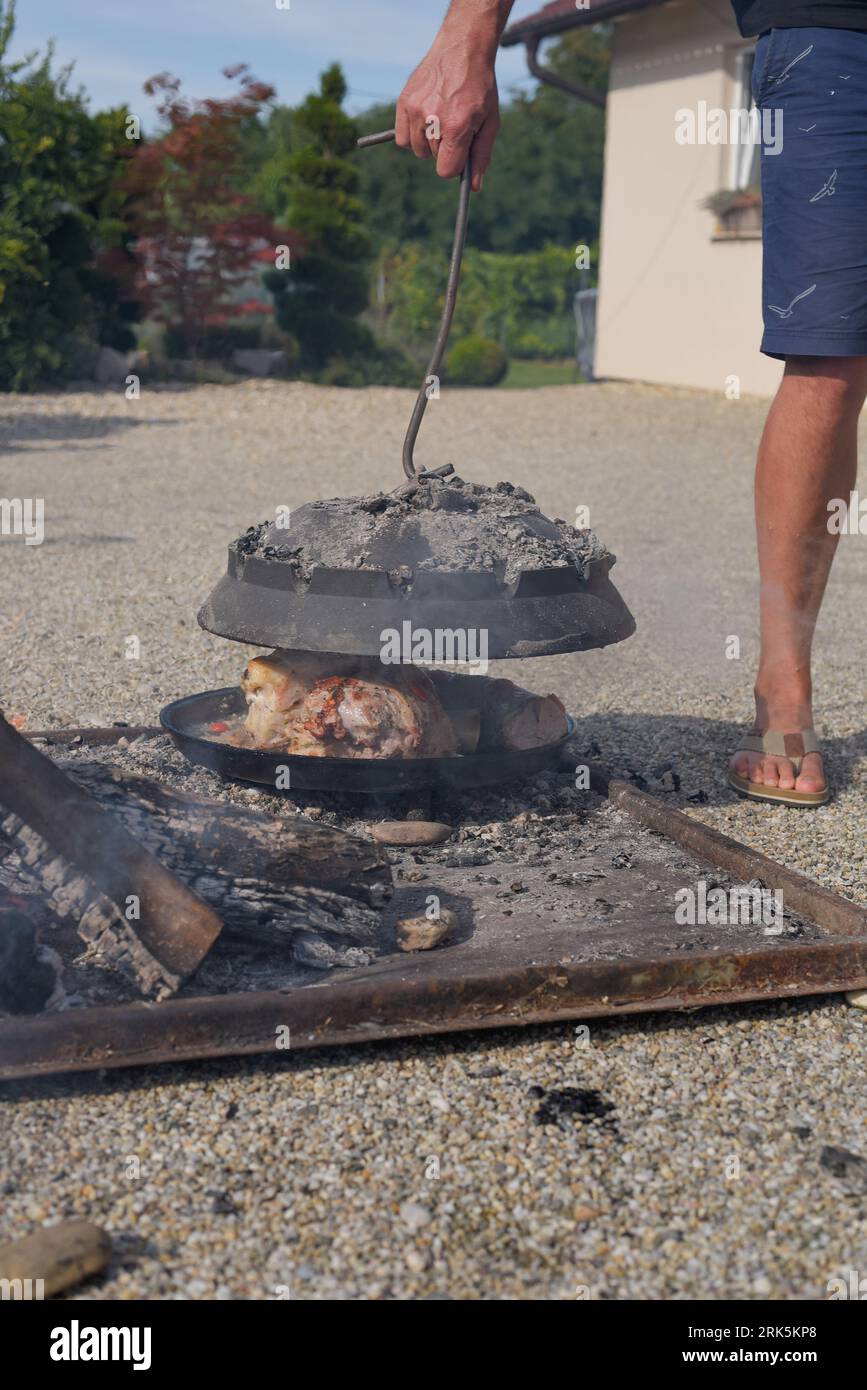 A vertical of Peka, a traditional method of preparing meal in Croatia ...