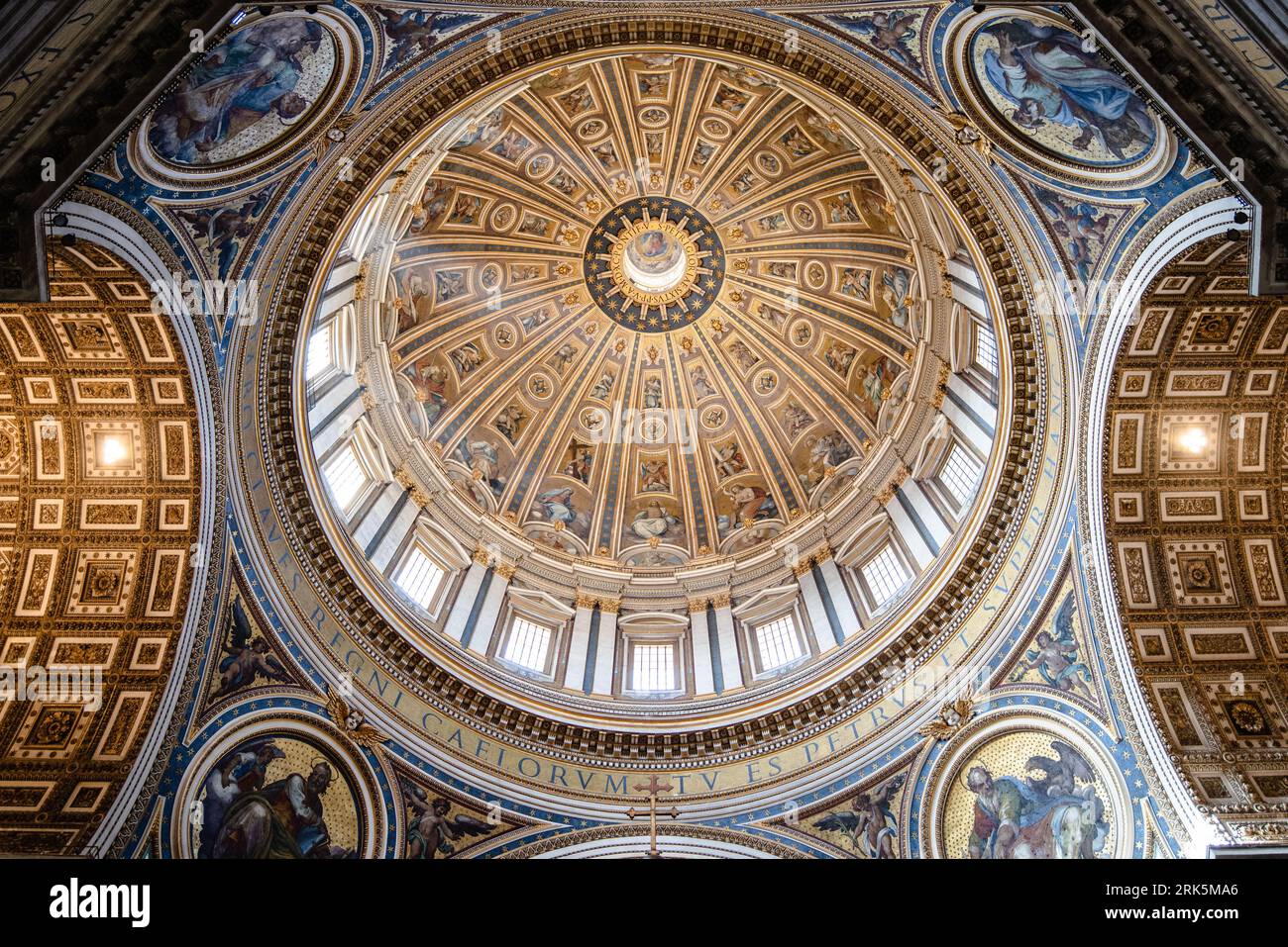 The grandiose domed ceiling of St. Peter's Basilica with intricate ...