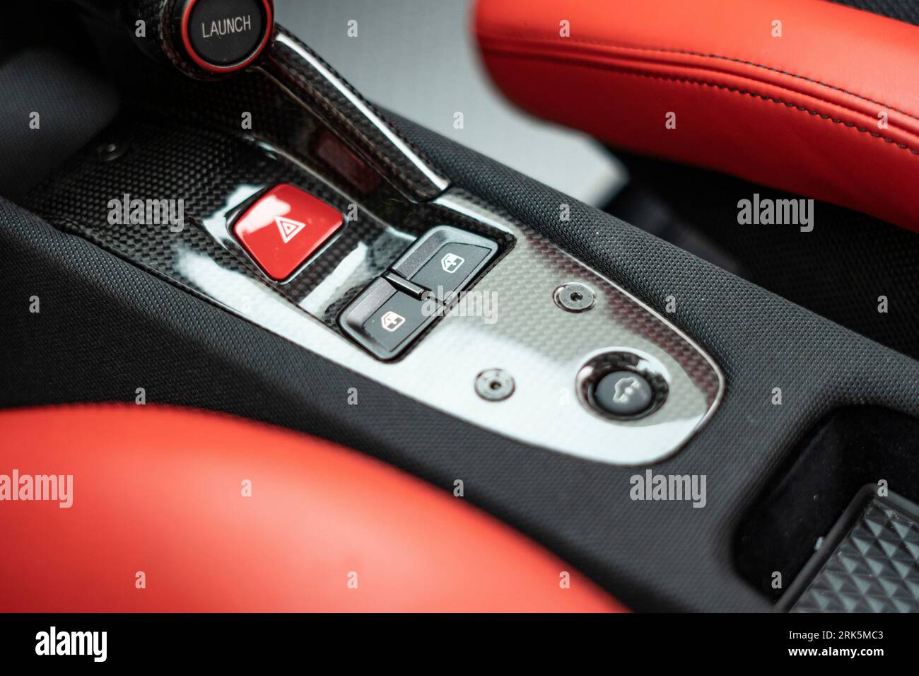 Close up view of a ferrari center console in carbon fiber with windows ...