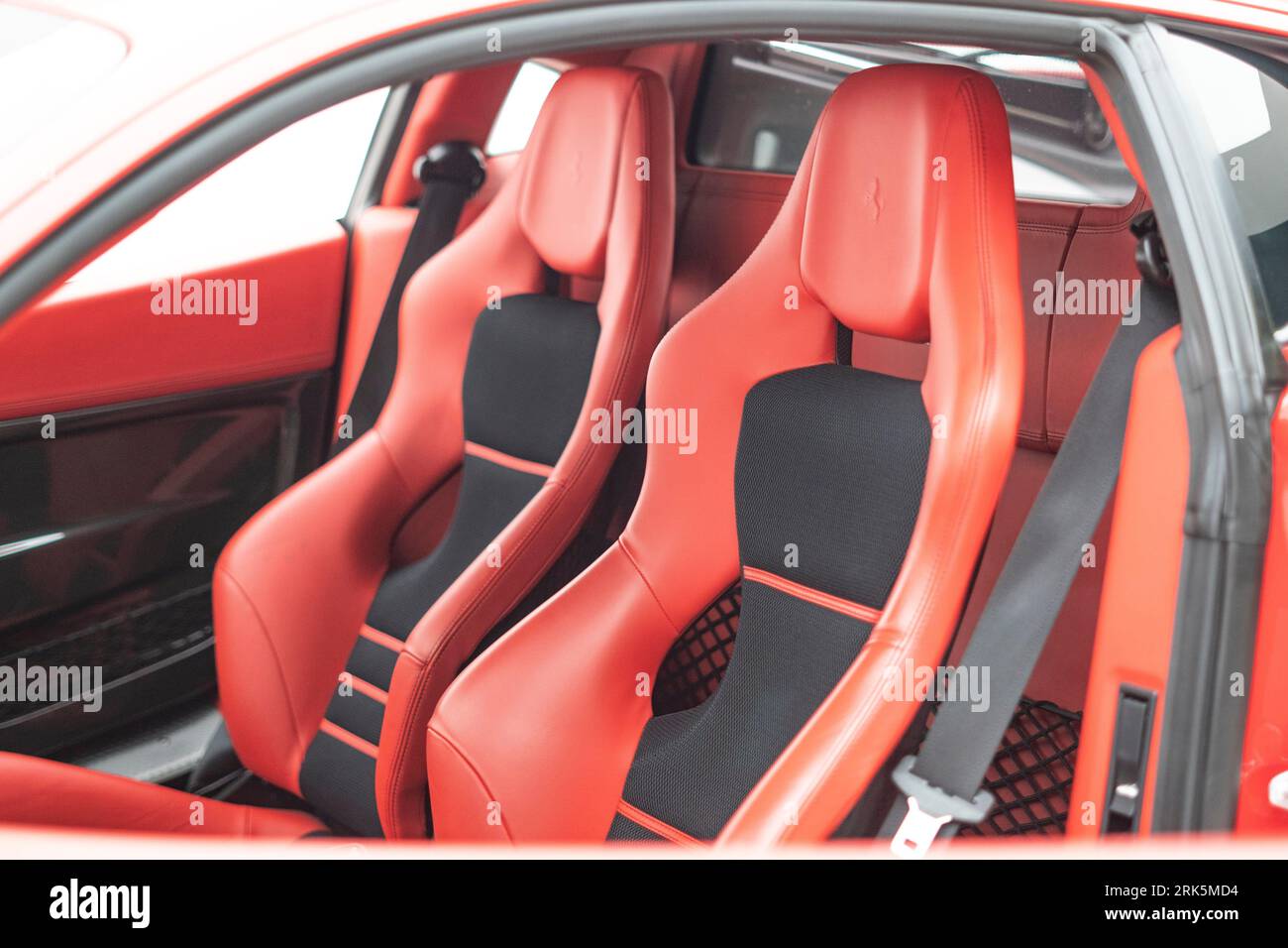 The inside view of a luxury red Ferrari 430 Scuderia sports car, with a ...