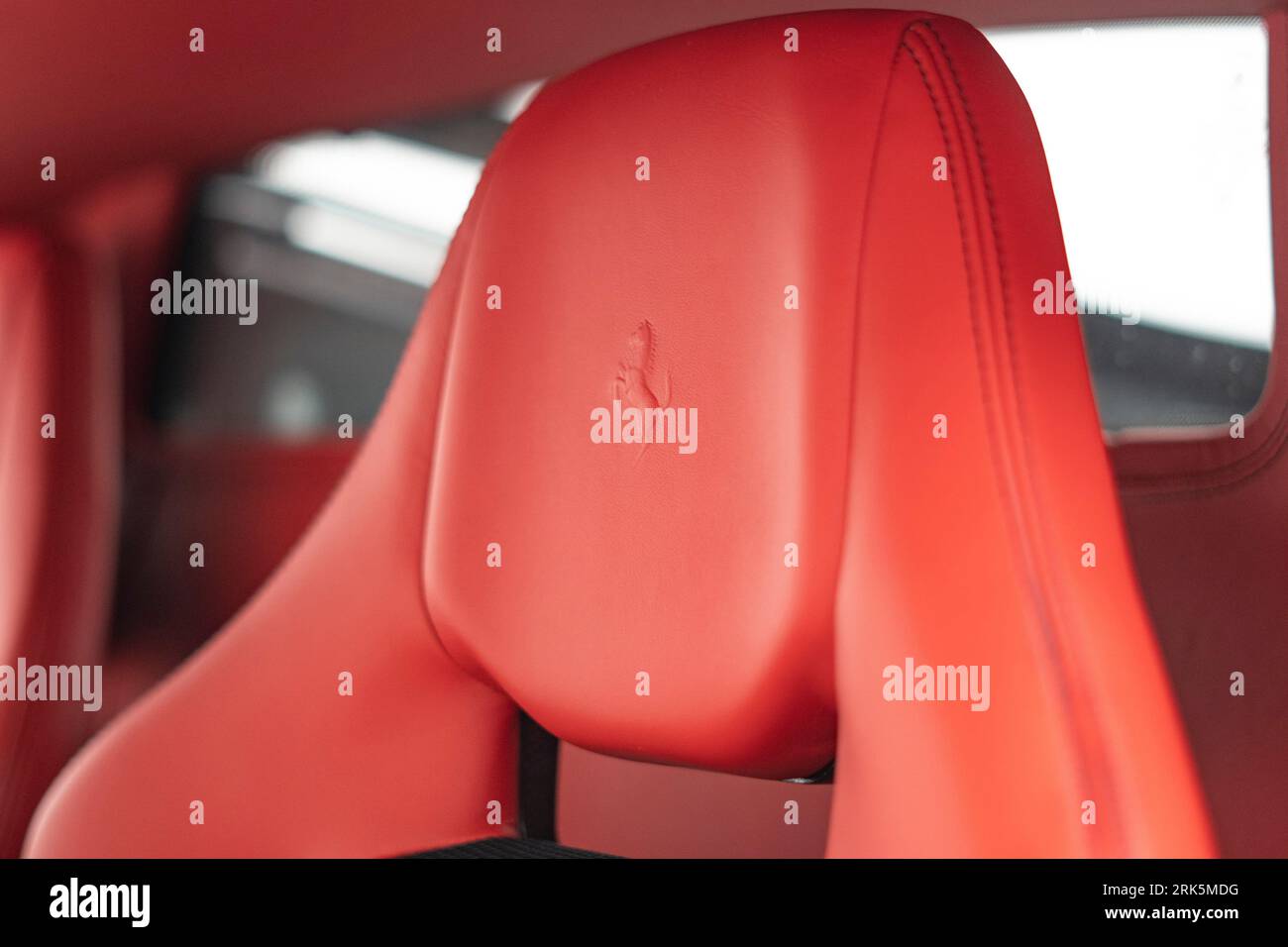 The inside view of a luxury red Ferrari 430 Scuderia sports car, with a ...