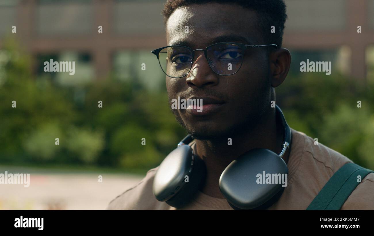 Close up portrait outdoors in park in city African American university ...