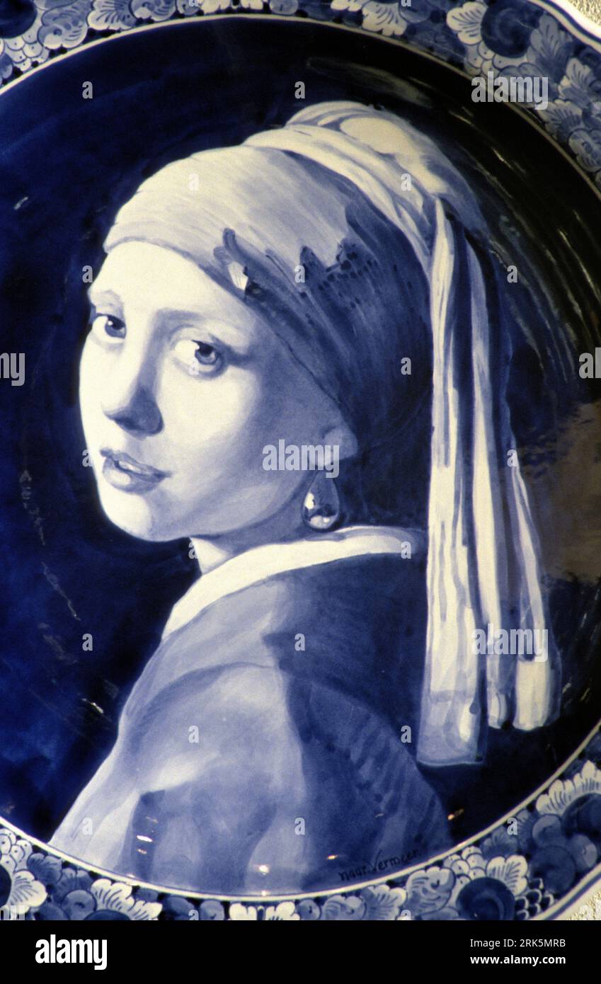 DELFT,HOLLAND- AUGUST 14,2023:Girl with a pearl earring made in typical ...