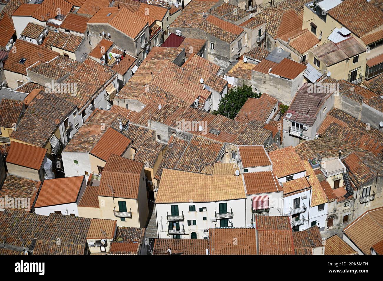 Scenic view of red clay tile rooftops in Cefalù one of the most ...