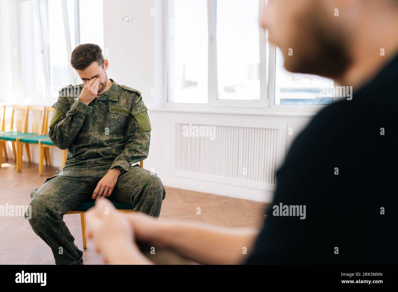 Portrait of group male soldiers in camouflage uniform talking sitting ...