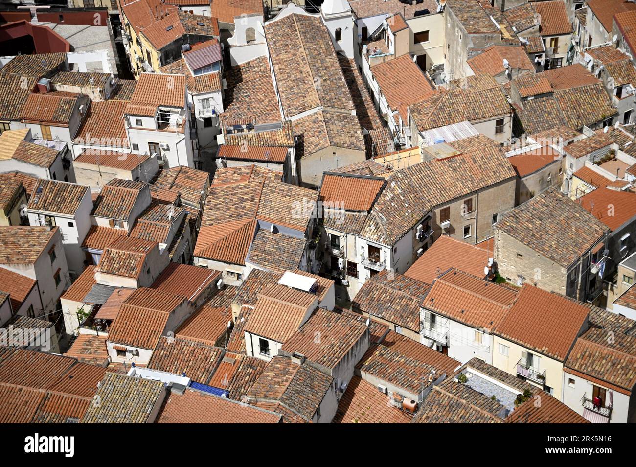 Scenic view of red clay tile rooftops in Cefalù one of the most ...