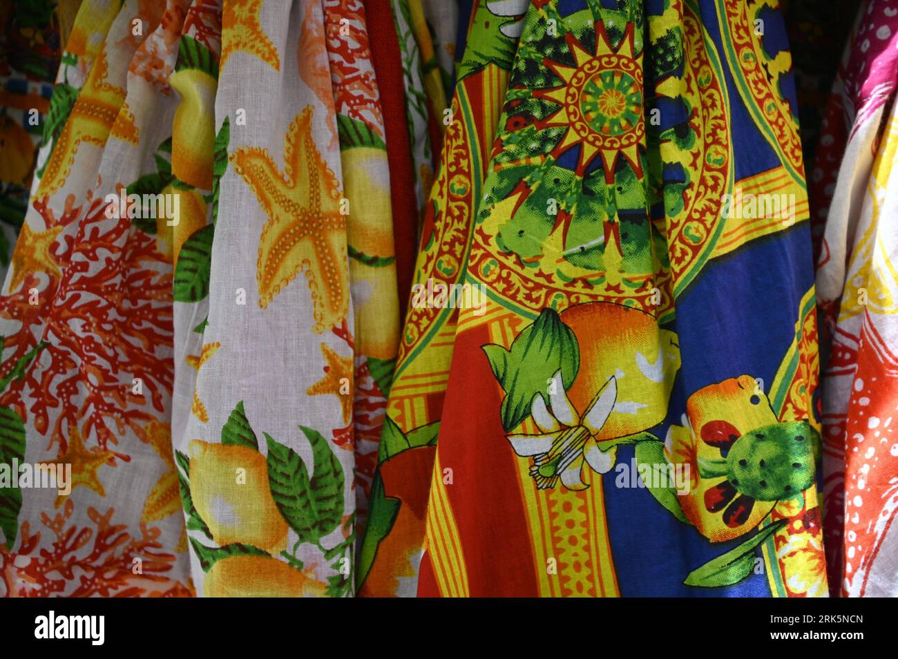 Traditional colorful Sicilian fabrics on display in Cefalù Sicily ...