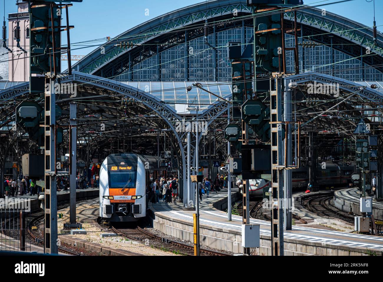 A local train leaving a railway station in Cologne, Germany Stock Photo ...