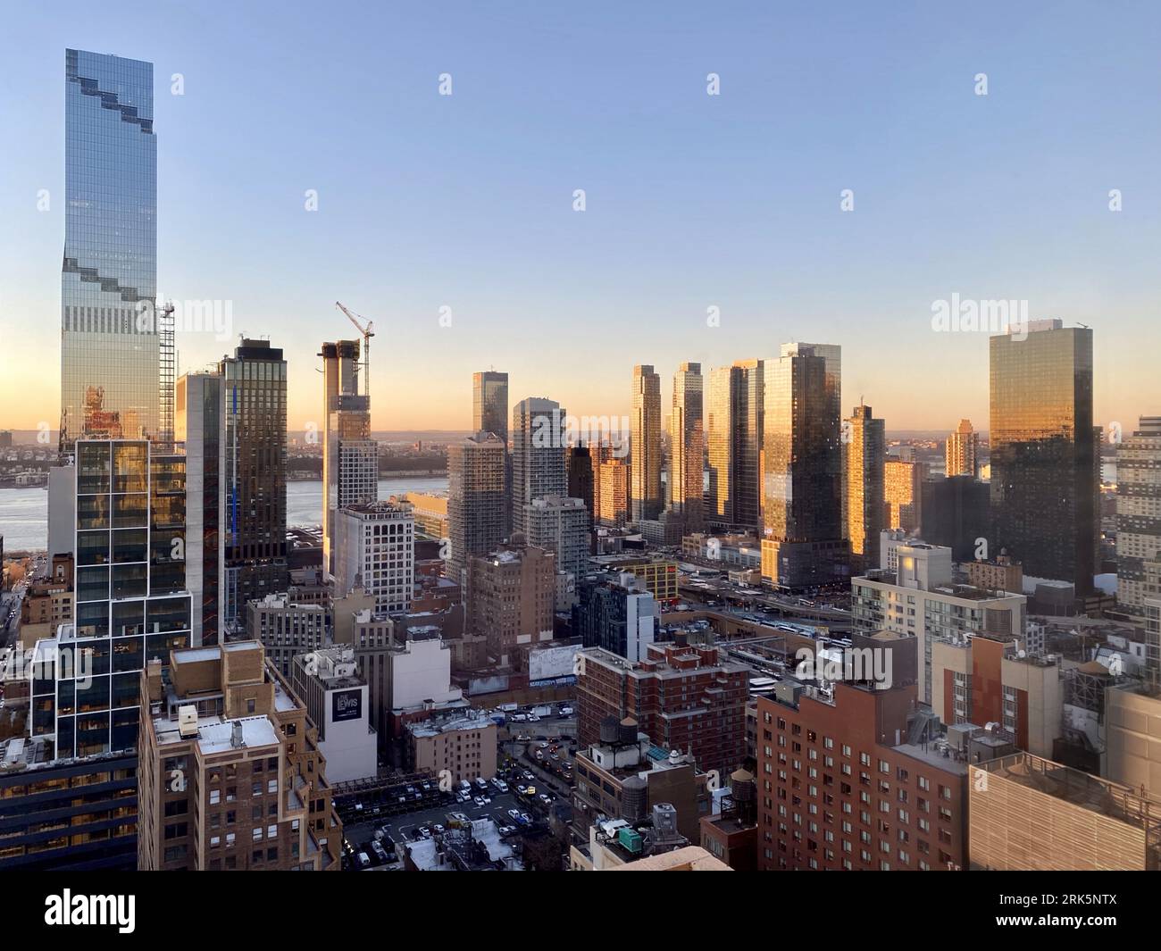 An aerial view of an urban skyline featuring a cluster of towering ...