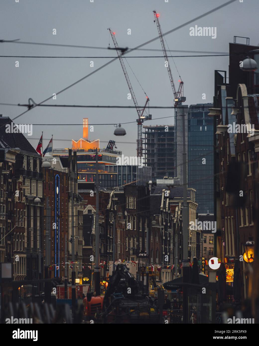 The rooftop of the A'DAM Toren, is visible above the buildings in the ...