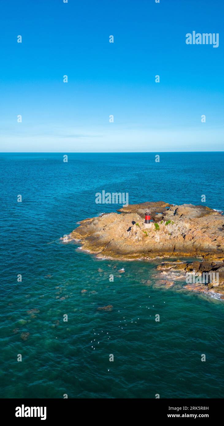 This image features a stunning aerial view of a small island in the ...