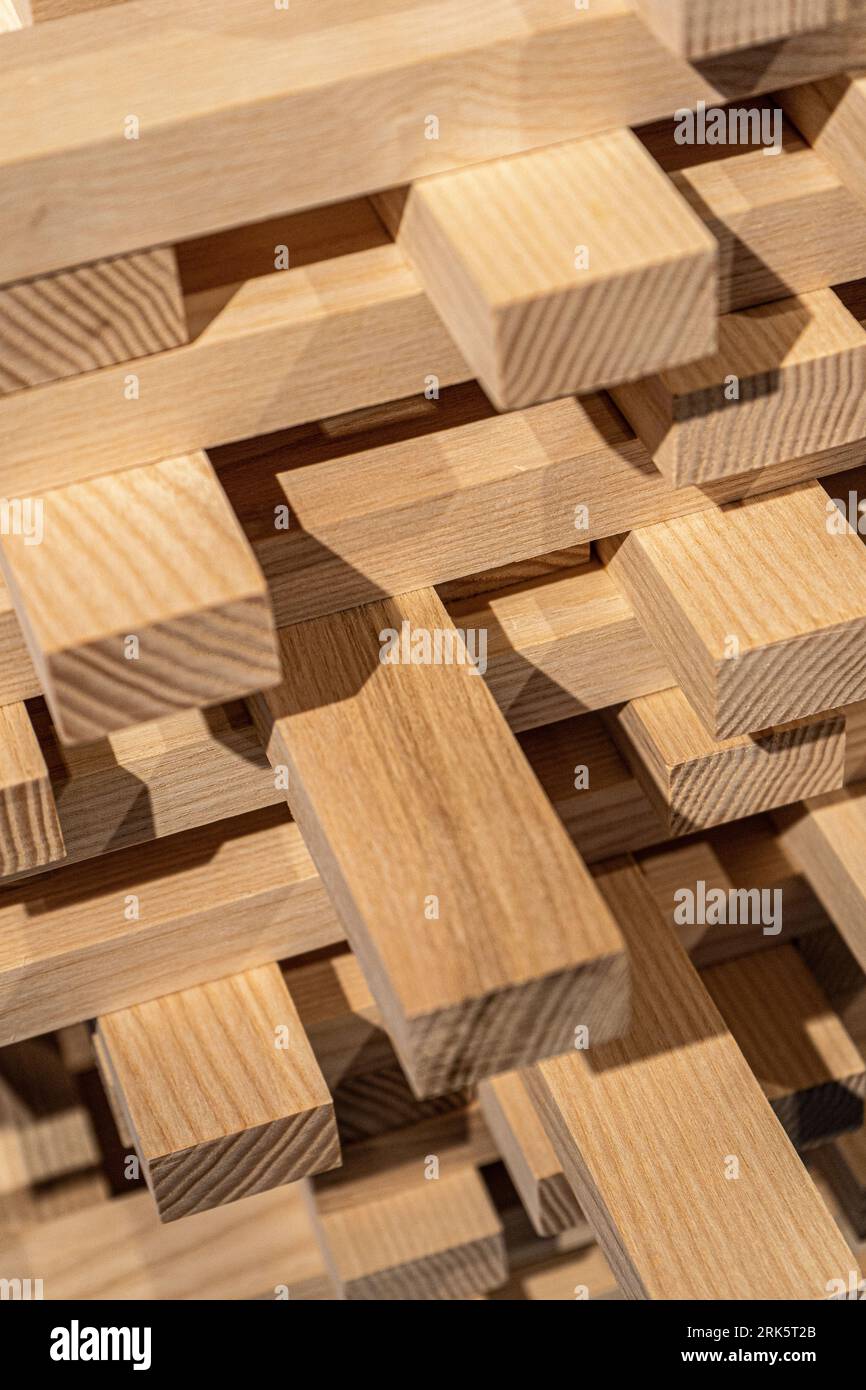 Wooden background. Big constructor from cut wooden blocks. Tower wall ...