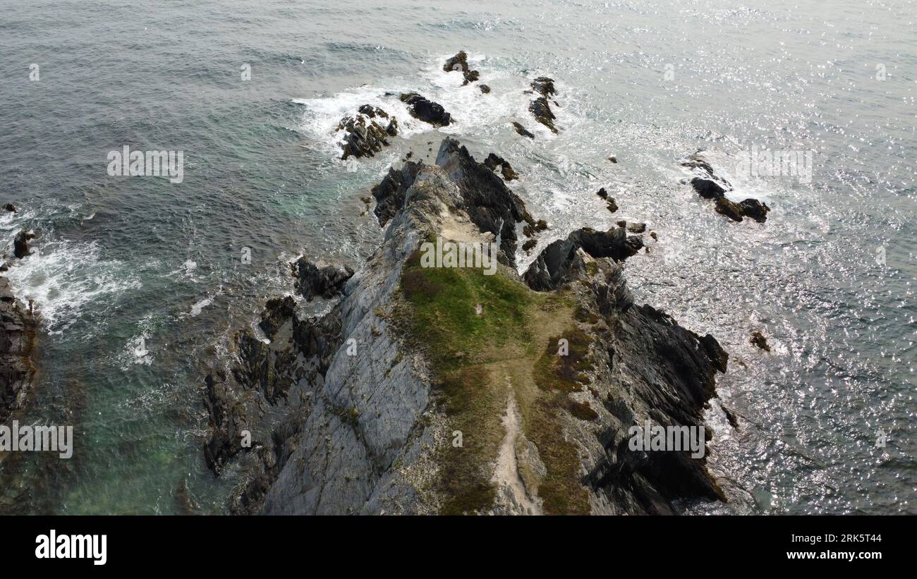 An aerial view of a large, isolated rock protruding from the surface of ...