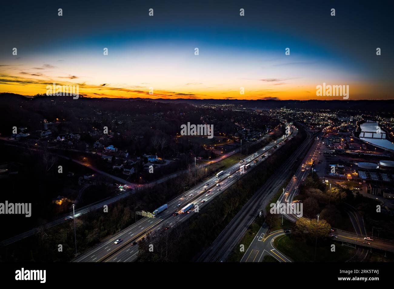 An aerial view of the cityscape illuminated at sunset Stock Photo - Alamy