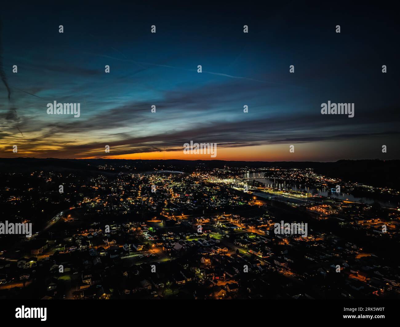 An aerial view of the cityscape illuminated at sunset Stock Photo - Alamy