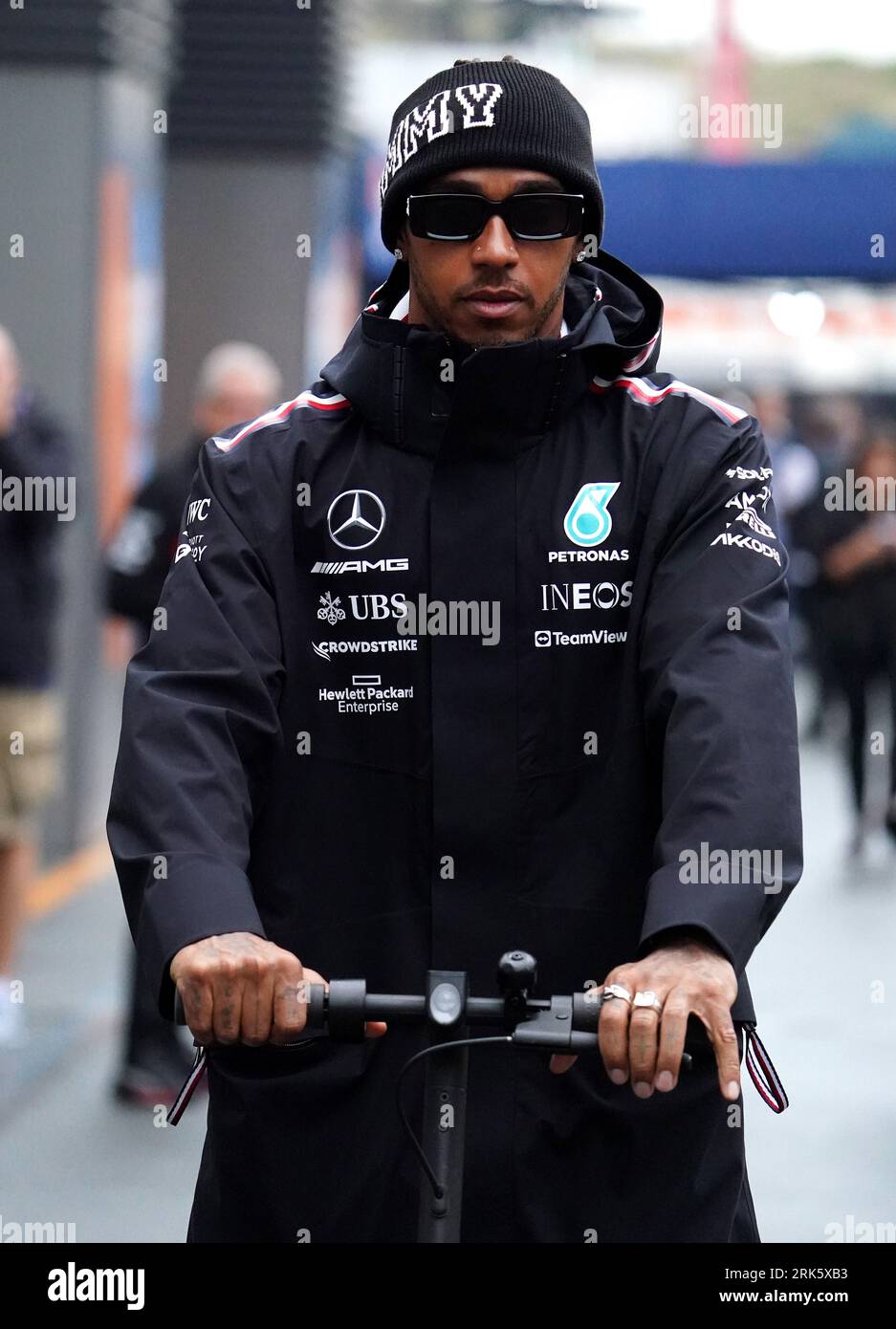 Mercedes F1 driver Lewis Hamilton on a motorized scooter during a ...