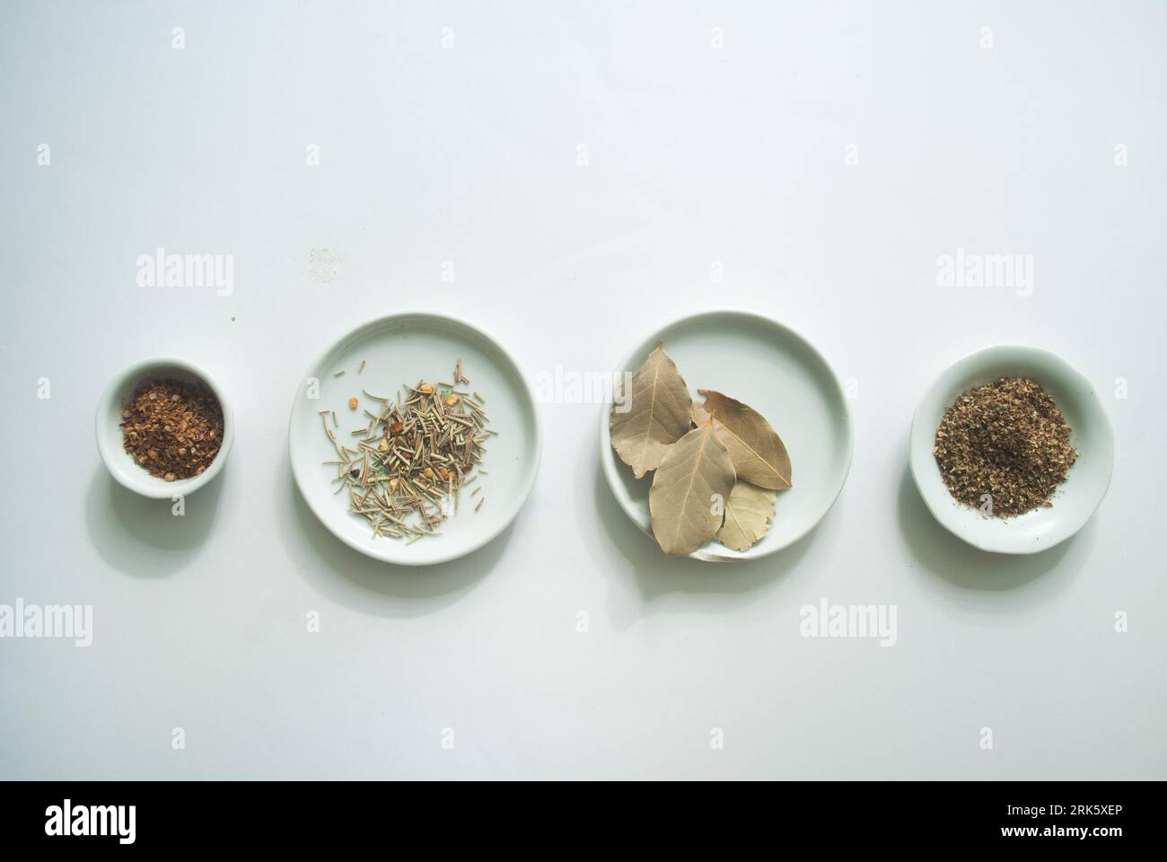 Three bowls of spices on a kitchen counter, ready for culinary ...