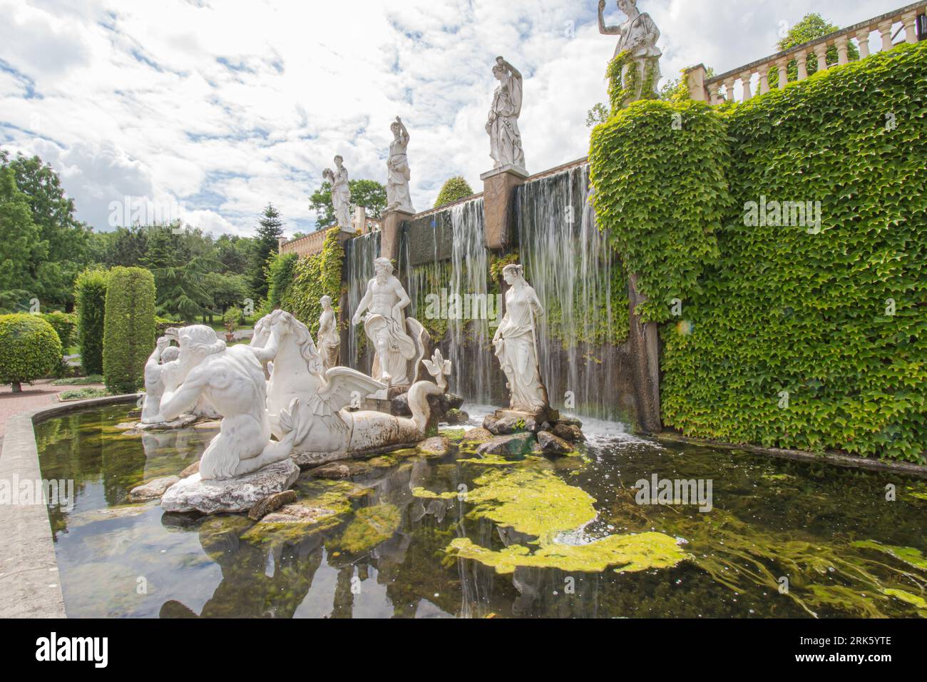 A luxurious villa garden with an impressive array of water features ...