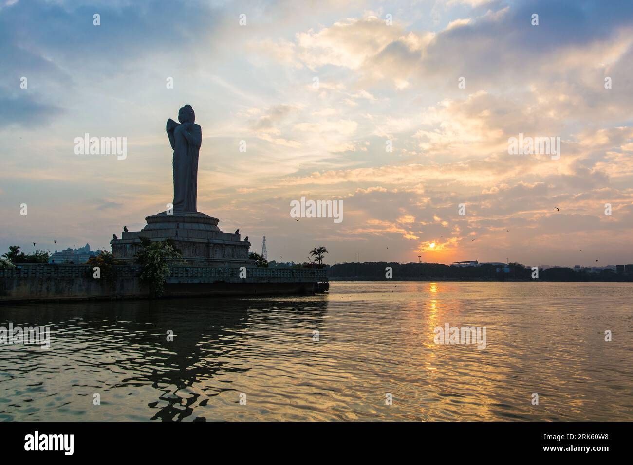 The statue of Buddha at sunset on the Hussain Sagar Lake. Hyderabad ...