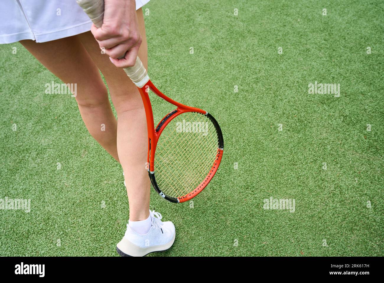 Female with beautiful, slender legs walks along the tennis court Stock ...
