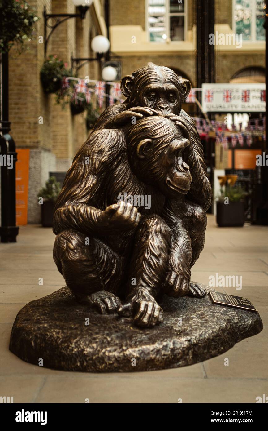 A bronze statue of two chimpanzees in London. England, UK Stock Photo ...