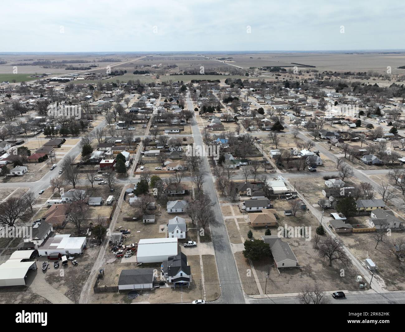 An aerial view of an idyllic rural cityscape featuring houses, trees ...