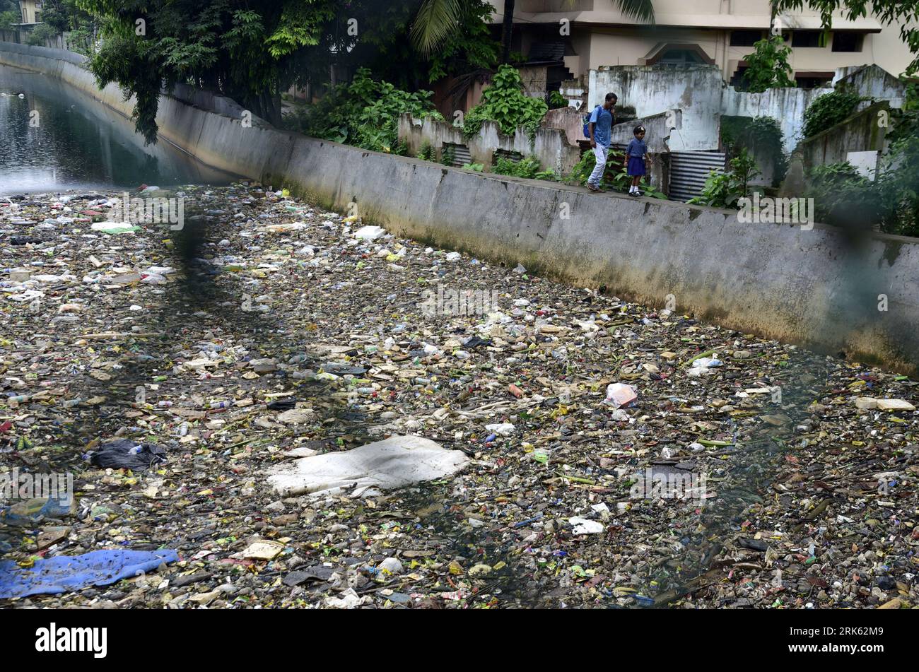 Guwahati, Guwahati, India. 24th Aug, 2023. A father along with his ...