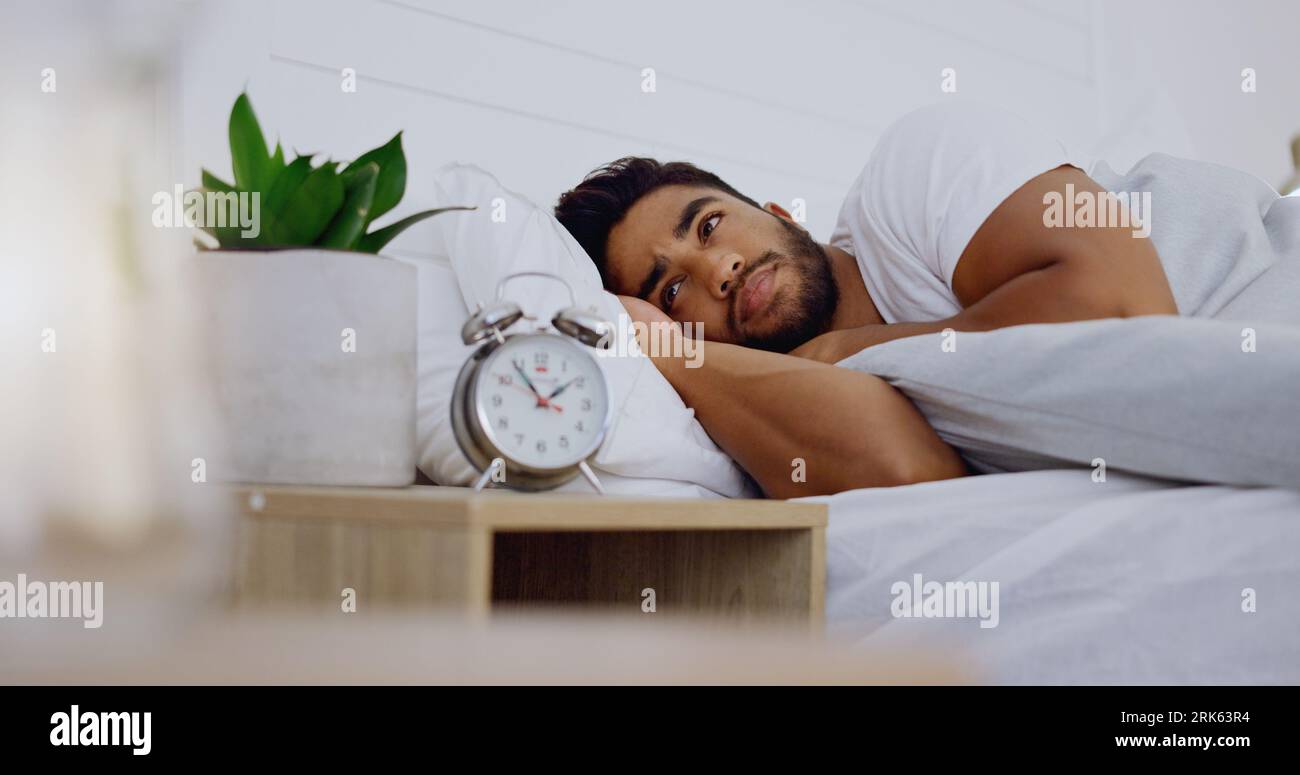 Stress, insomnia and man in bedroom, anxiety and depression with mental ...