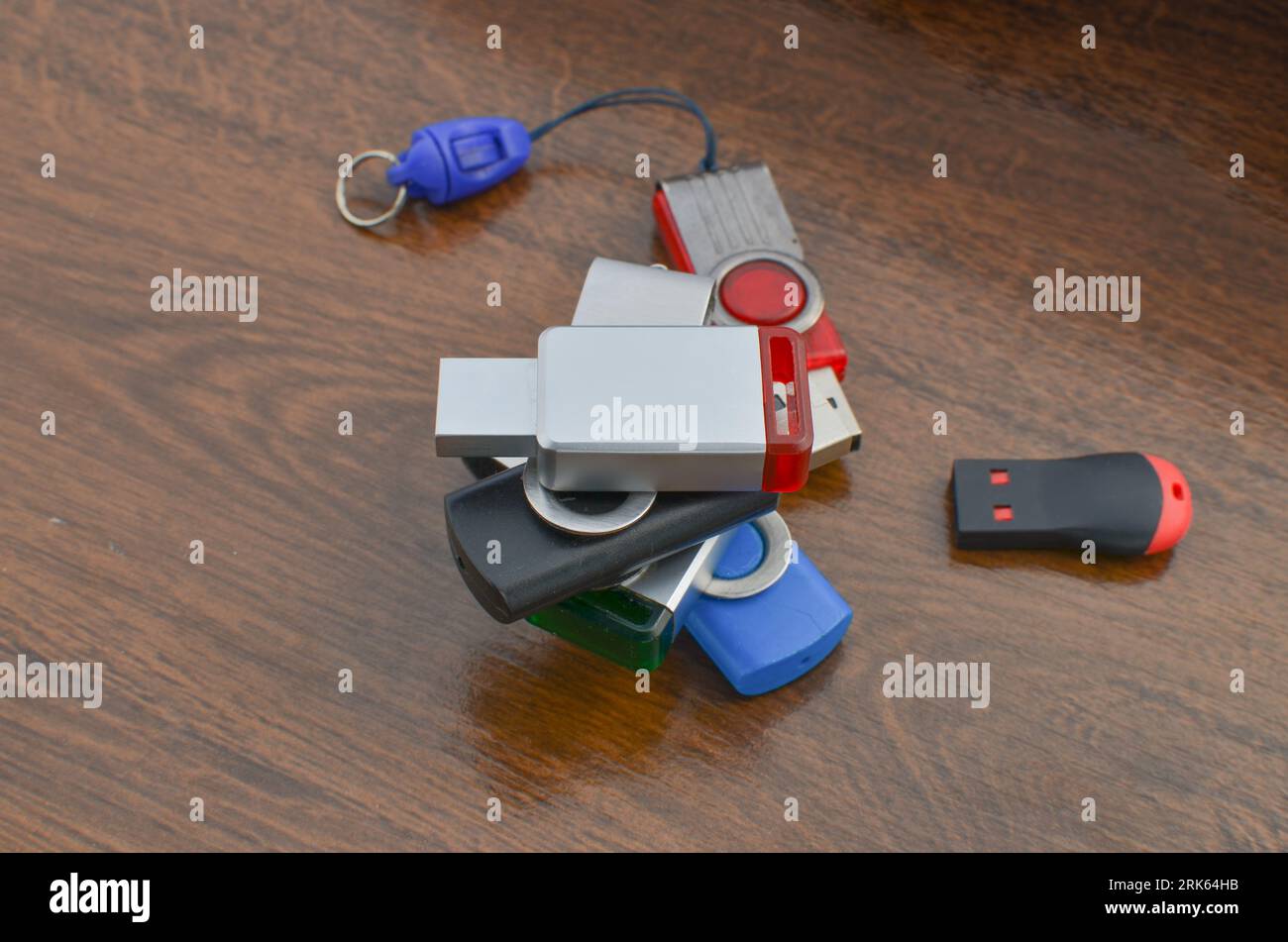 Closeup of several USB sticks on the wooden table. Several different ...