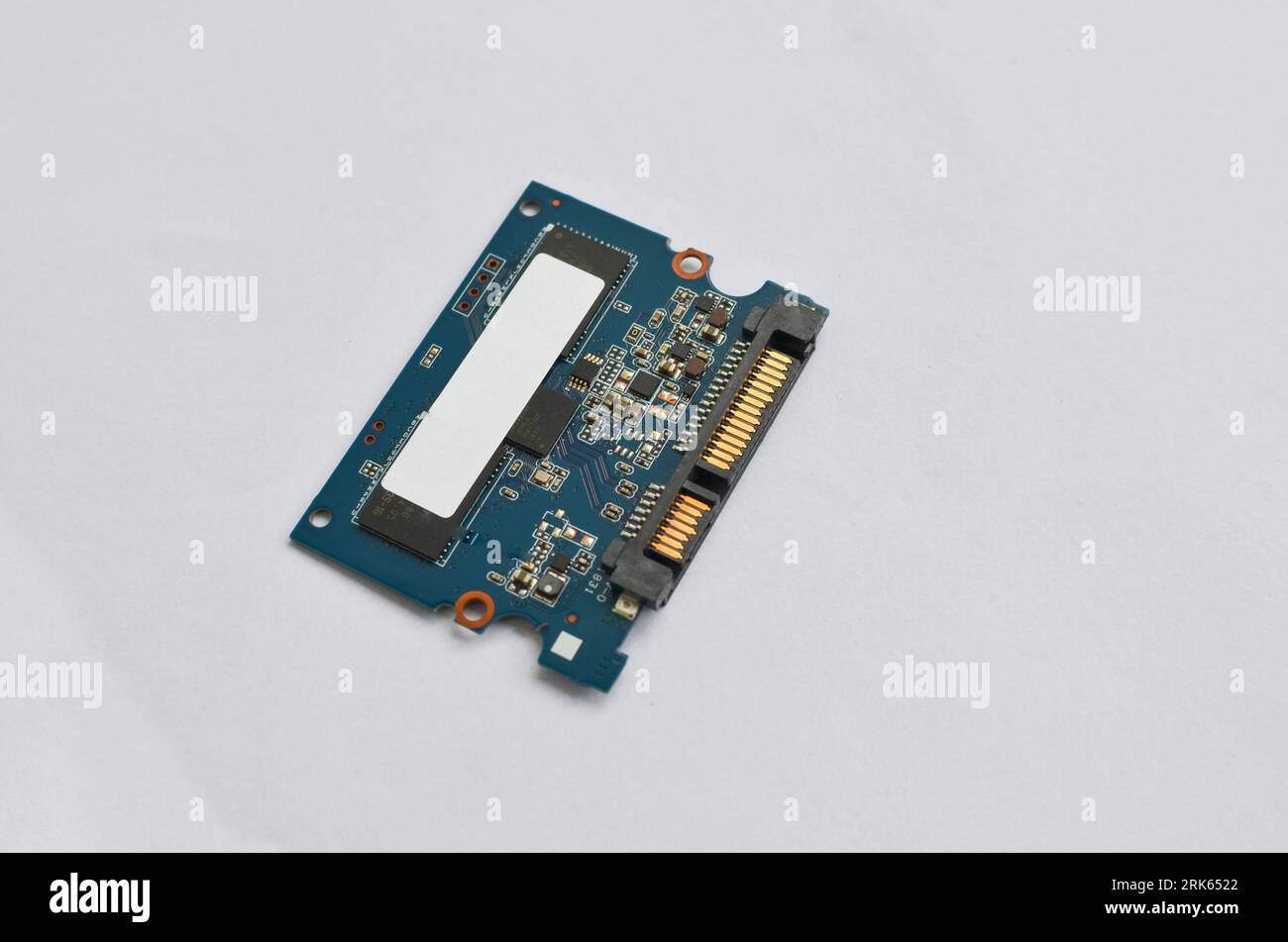 Detail of open SSD with exposed logic board for repair and data ...