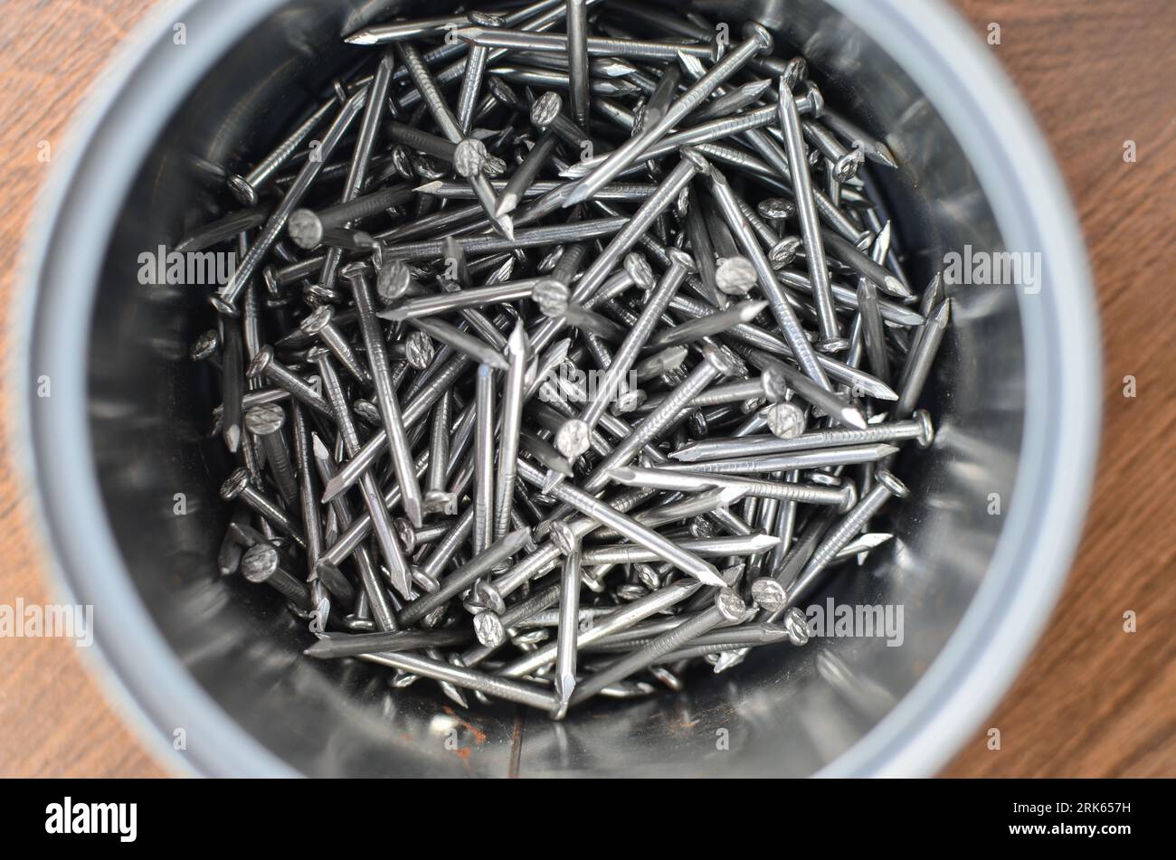 Detailed closeup of several steel nails, perfect for illustrating or ...