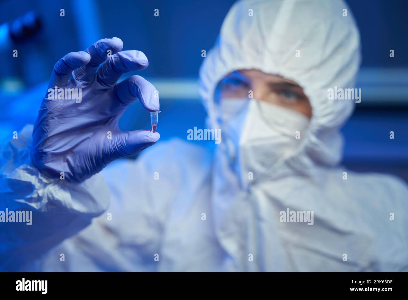 Laboratory assistant in a sterile uniform holds a test tube Stock Photo ...