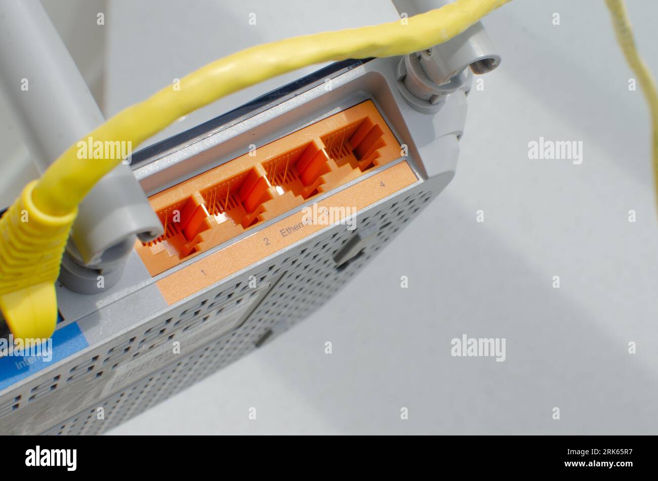 Close-up detail of a modern Wi-Fi router, with multiple inputs and ...