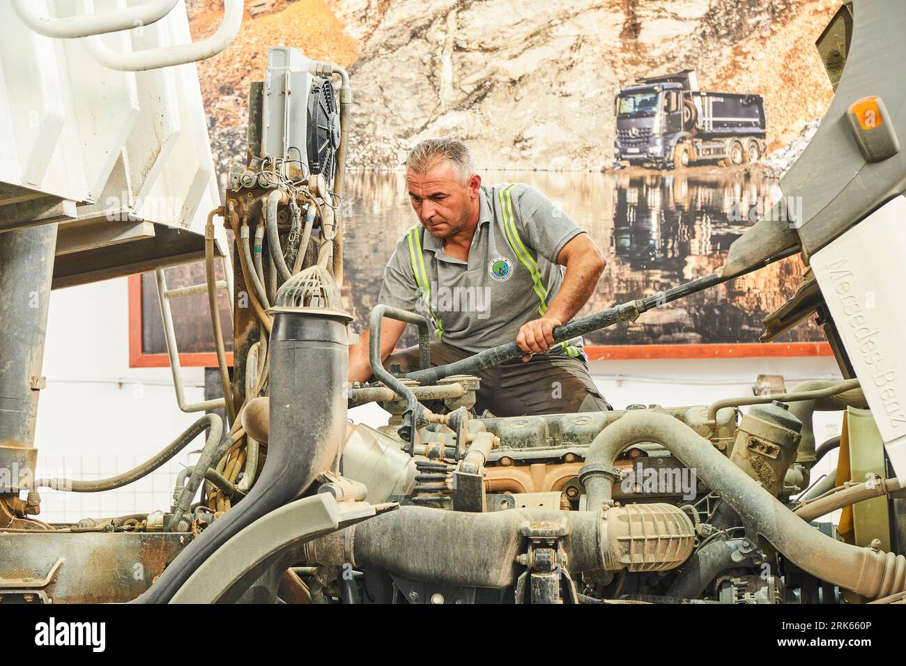 working man in a workshop/factory. man working on metal. metalworking ...