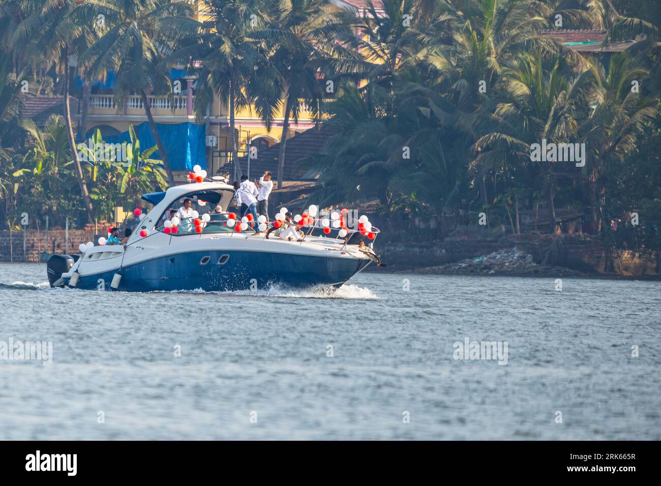 A medium-sized vessel is packed with passengers and cruising through a ...