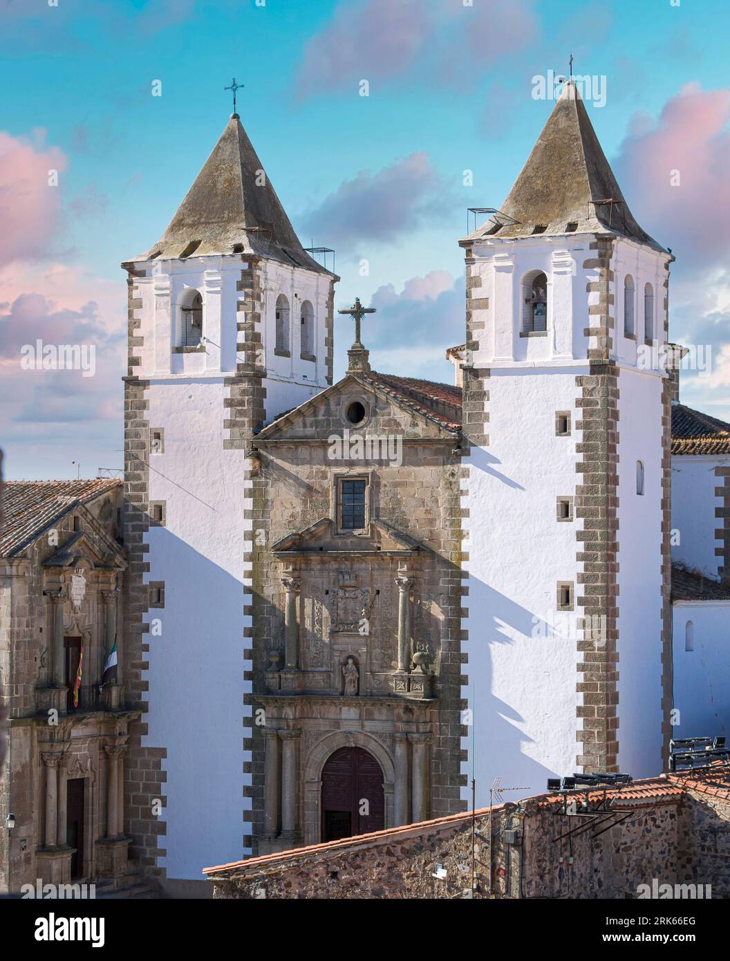 Two large, white buildings standing in the foreground of a beautiful ...