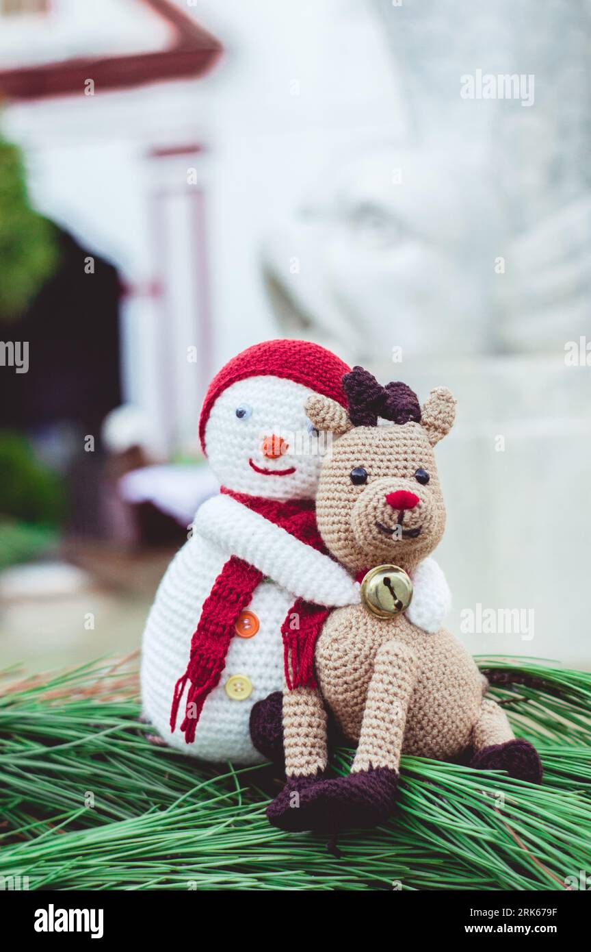 Two crocheted dolls side-by-side on a lush green grassy surface Stock ...