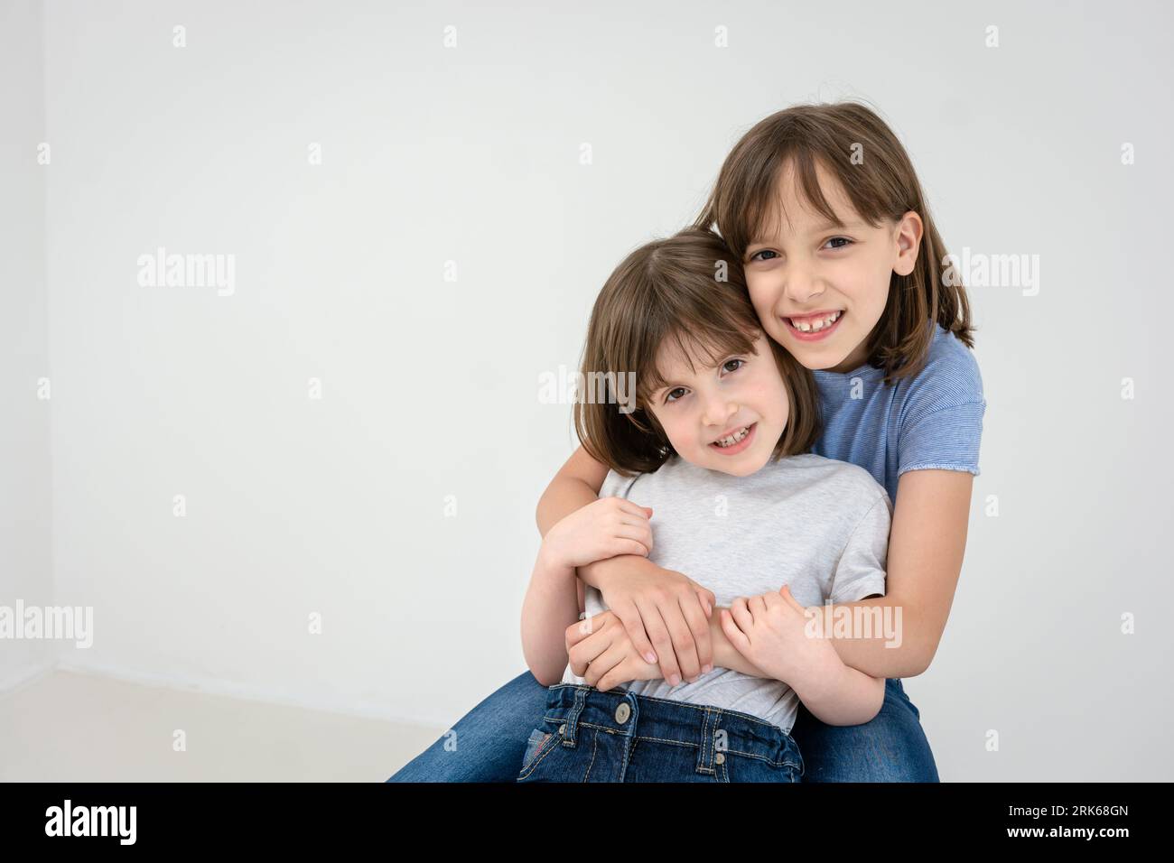 Kids hug white background hi-res stock photography and images - Alamy