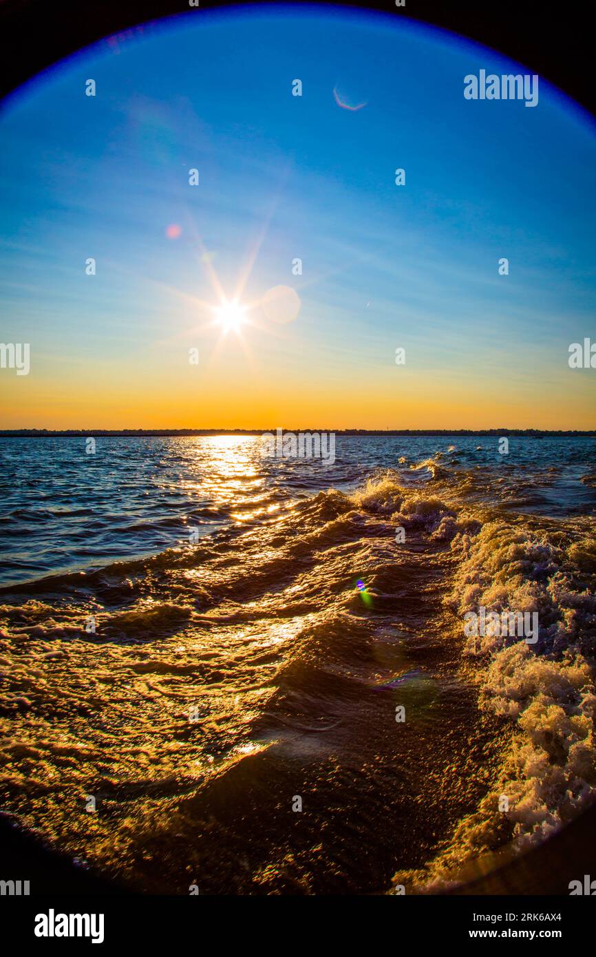 A breathtaking ocean view with a gorgeous sunset in the sky Stock Photo ...