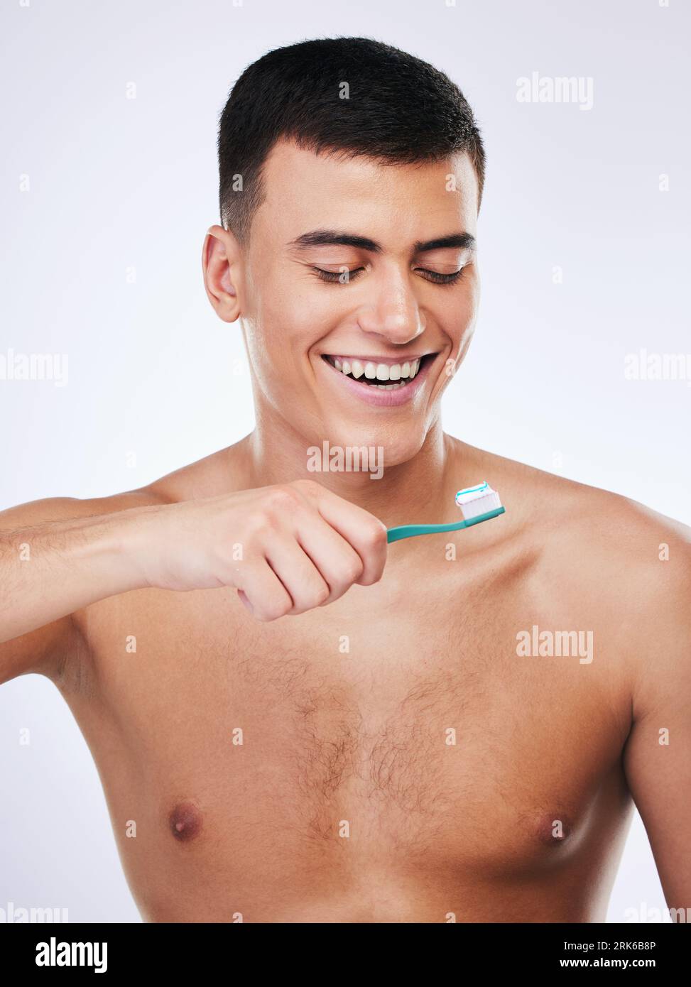 Happy man, toothbrush and cleaning teeth in dental care hygiene or grooming against a white ...
