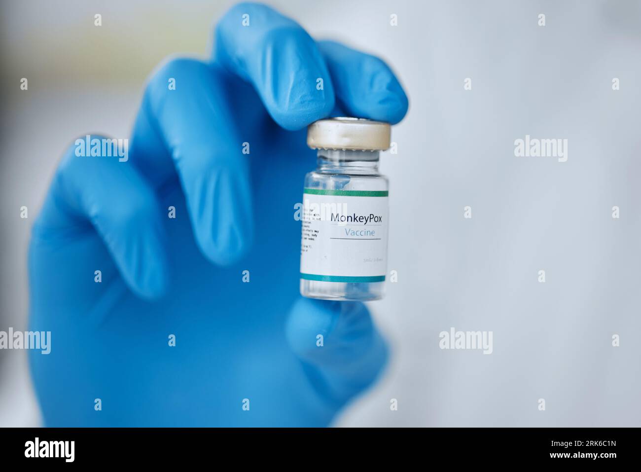 Monkeypox, vaccine and glass bottle in hand, health and doctor person ...