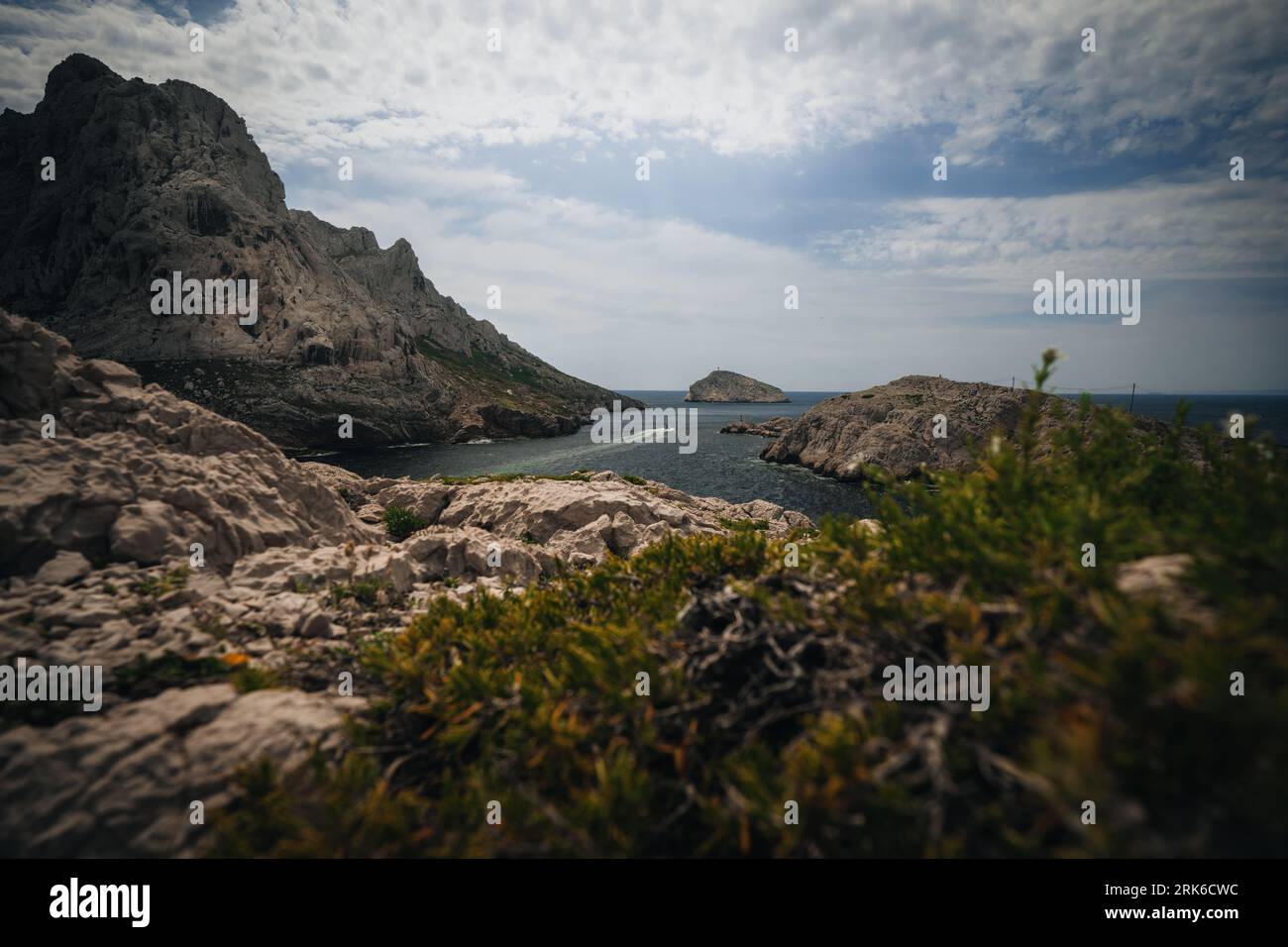 A scenic landscape featuring a tranquil body of water surrounded by ...